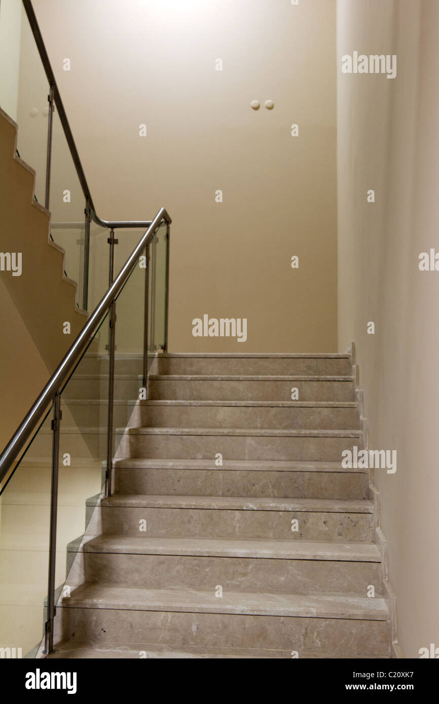 Corridor and the marble staircase with steel handrails Stock Photo - Alamy