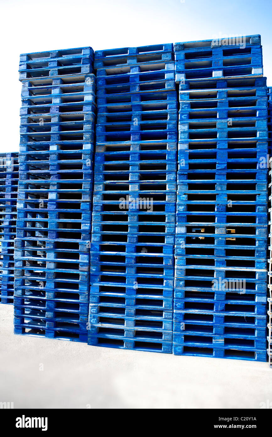 Stack of blue wooden pallets, stacks Stock Photo - Alamy