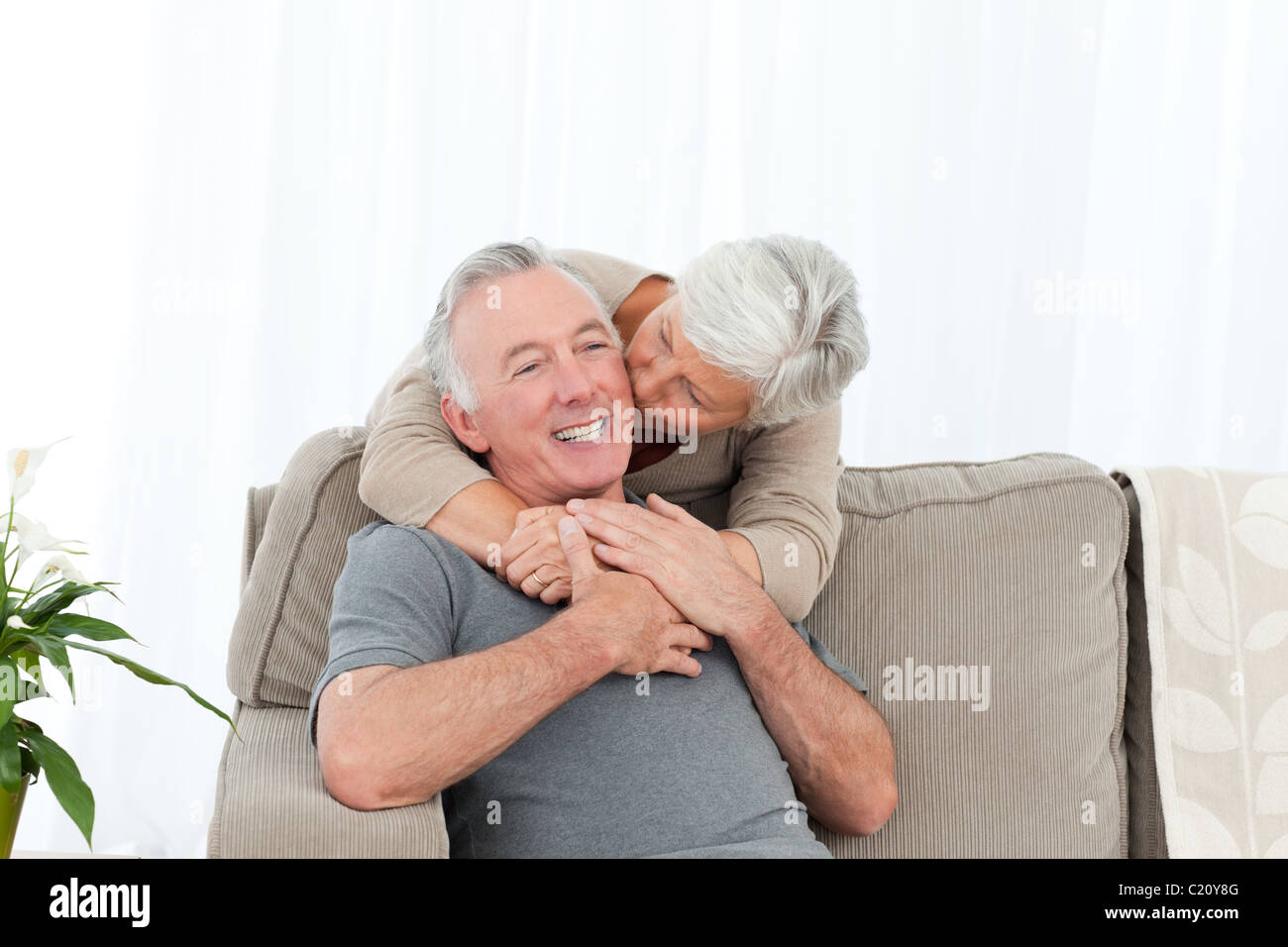 Lovers hugging while they are looking at the camera Stock Photo - Alamy