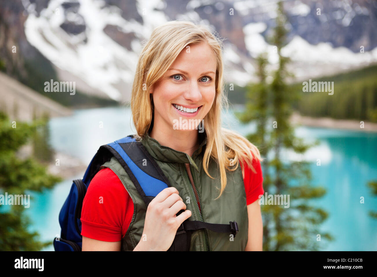 Portrait of happy beautiful female hiker smiling Stock Photo - Alamy