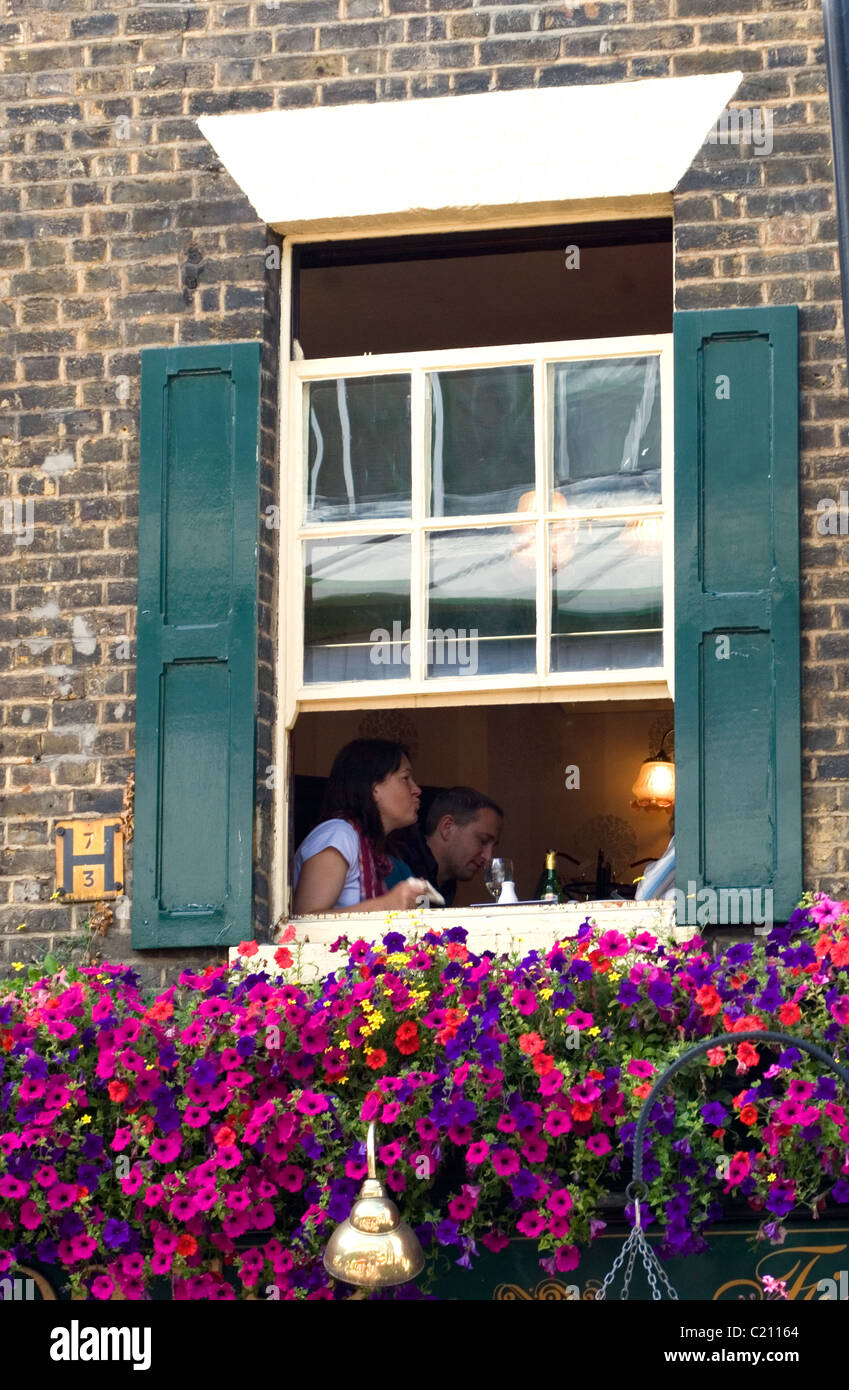 Group having lunch in a traditional pub thought a window Stock Photo ...