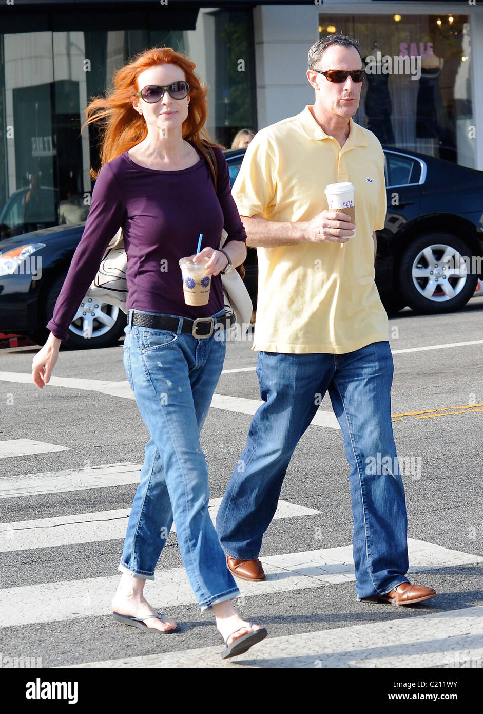 Actress Marcia Cross and husband Tom Mahoney carrying coffees while ...