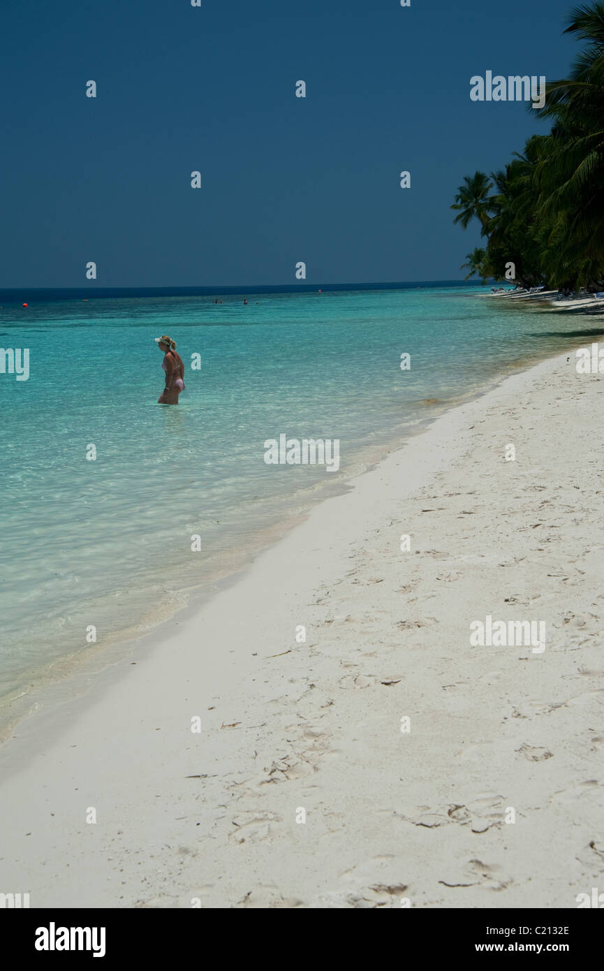 Taking a dip in the ocean in the Maldives Stock Photo - Alamy