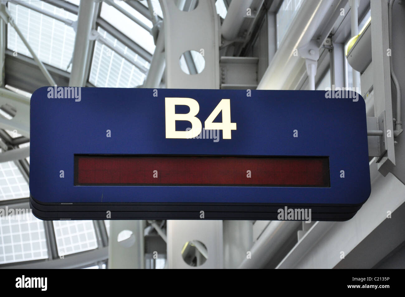 a dark blue airport B4 gate sign Stock Photo - Alamy