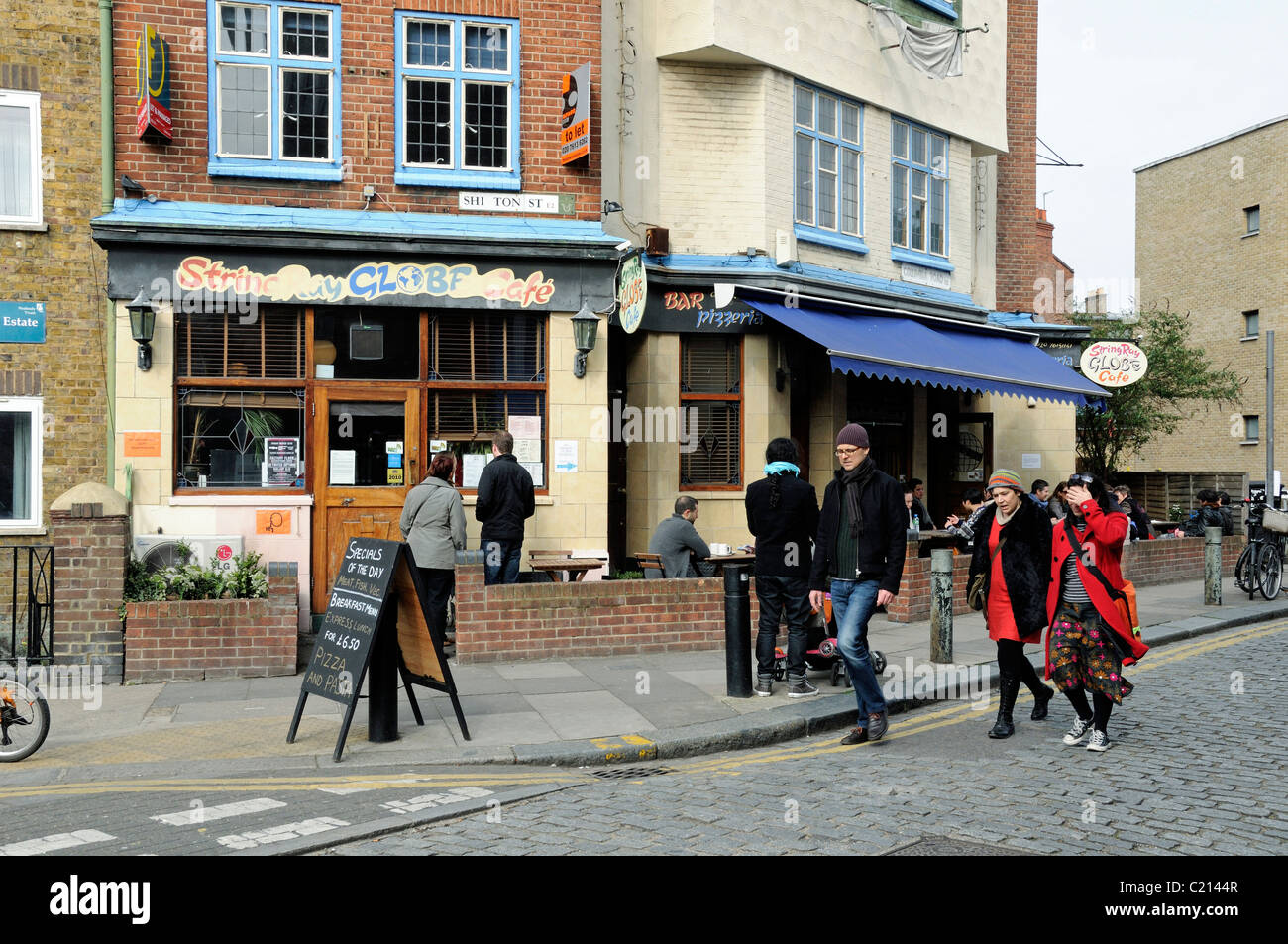 People passing String Ray Globe Cafe Columbia Road Flower Market Tower ...