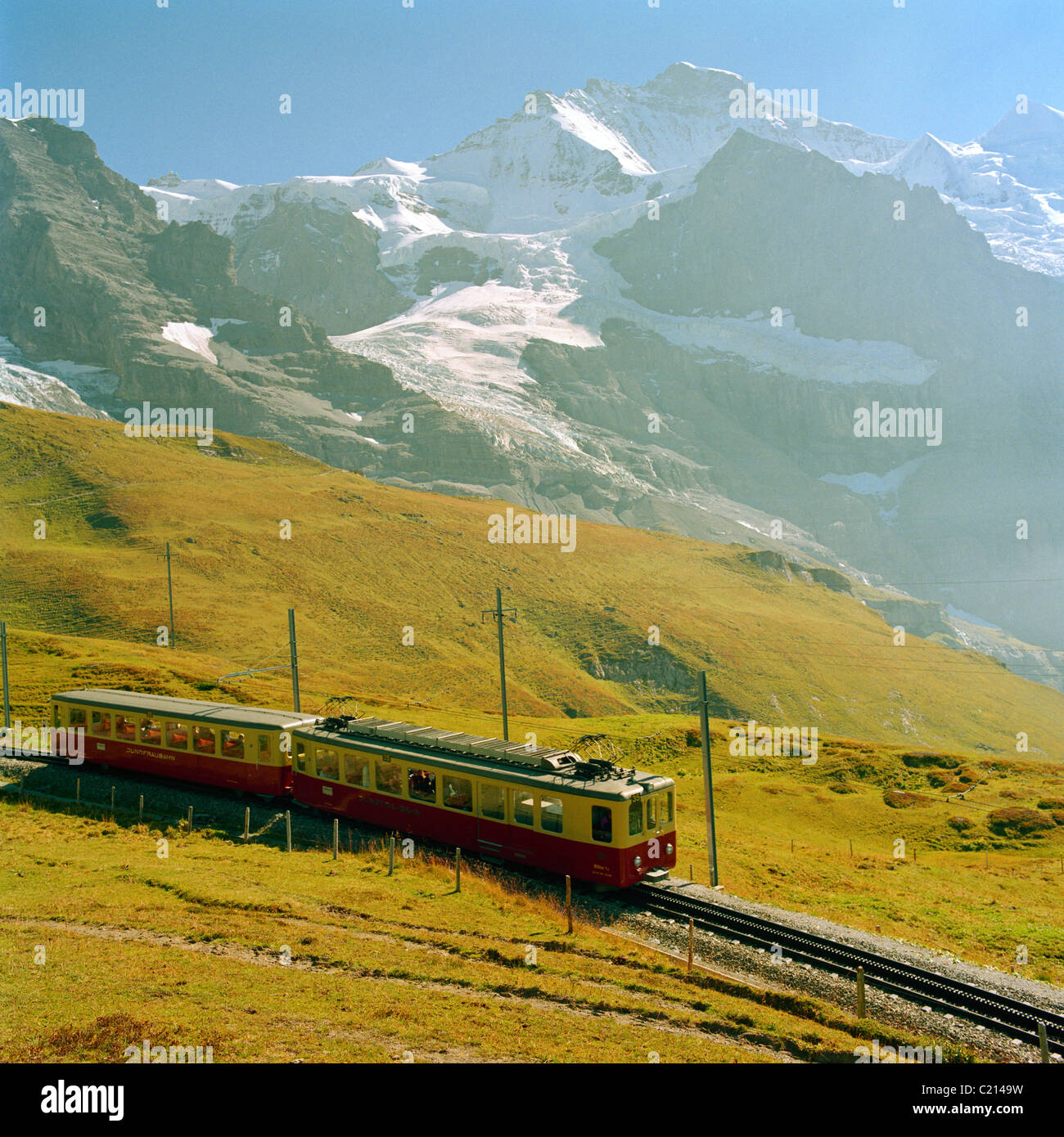 Cogwheel train of the Jungfrau Railway descends towards Wengen Stock ...