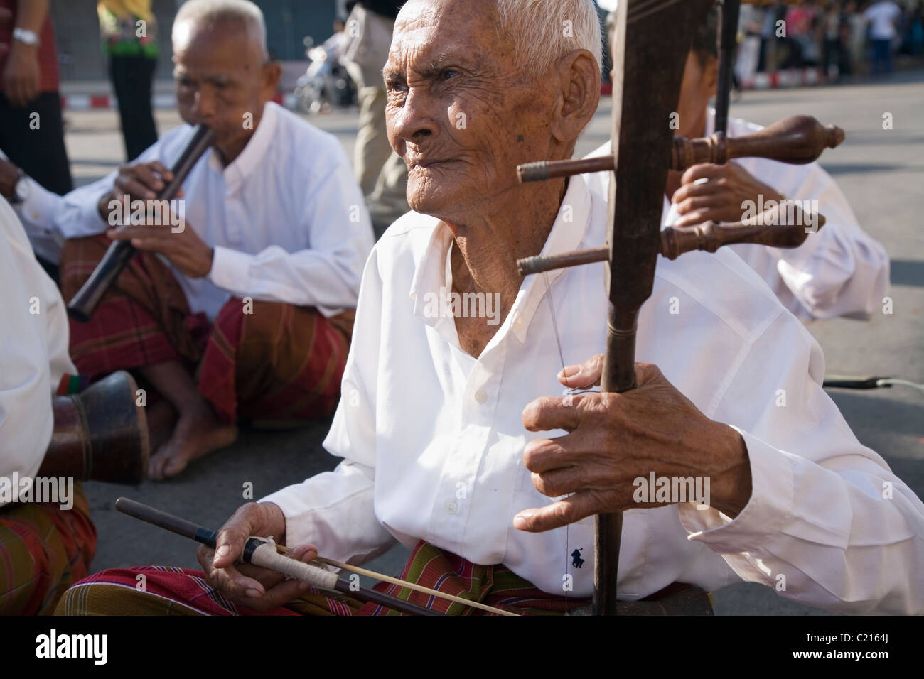 Thai musician playing a saw u (bowed string instrument) at the Surin ...