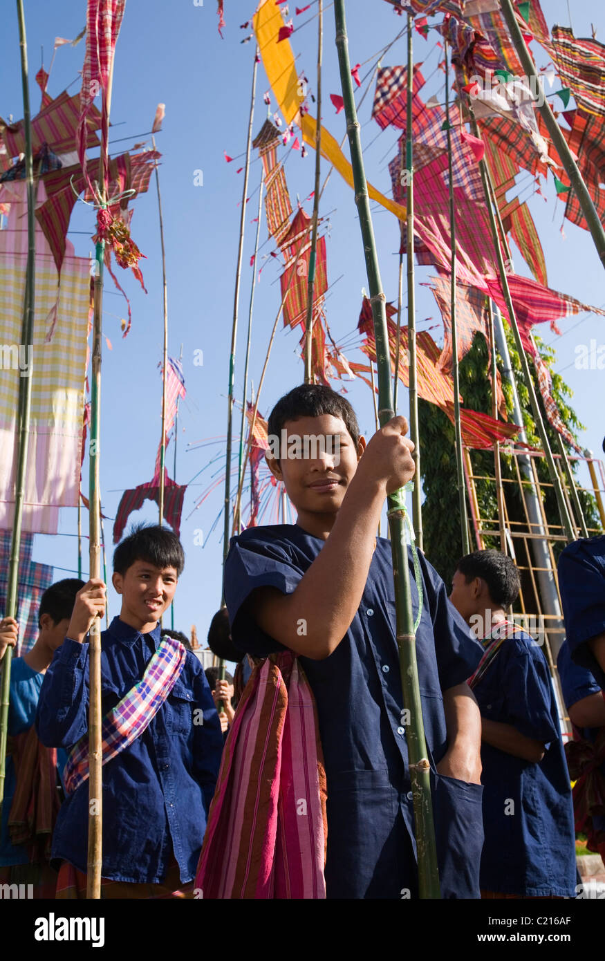 Children carry flags through the streets of Surin during the annual ...