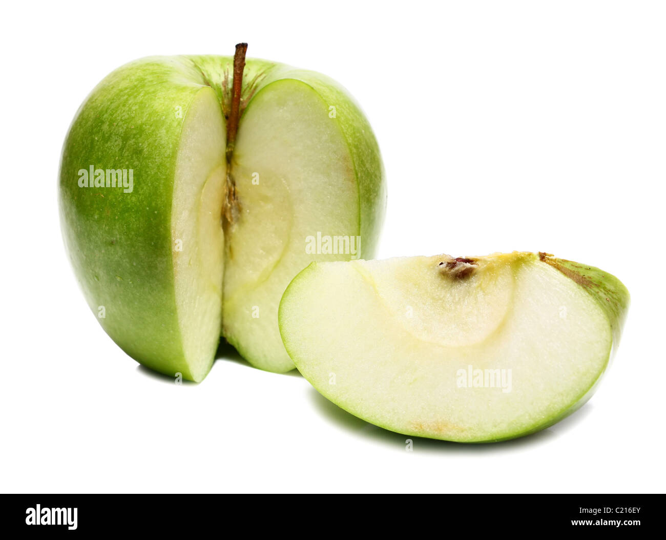 cut apple to pieces isolated on white background Stock Photo - Alamy