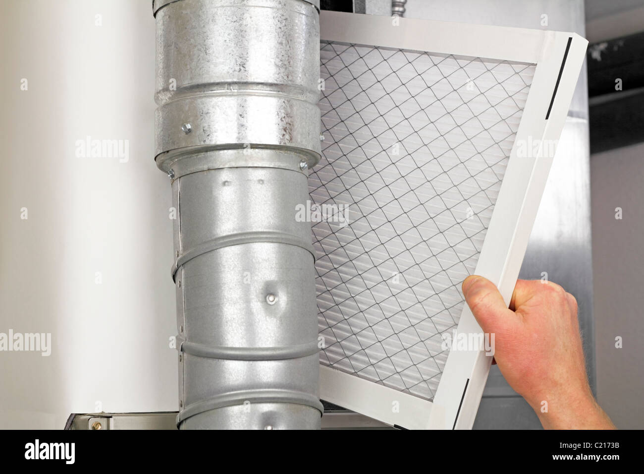 Home furnace air conditioning filter being changed as part of ...