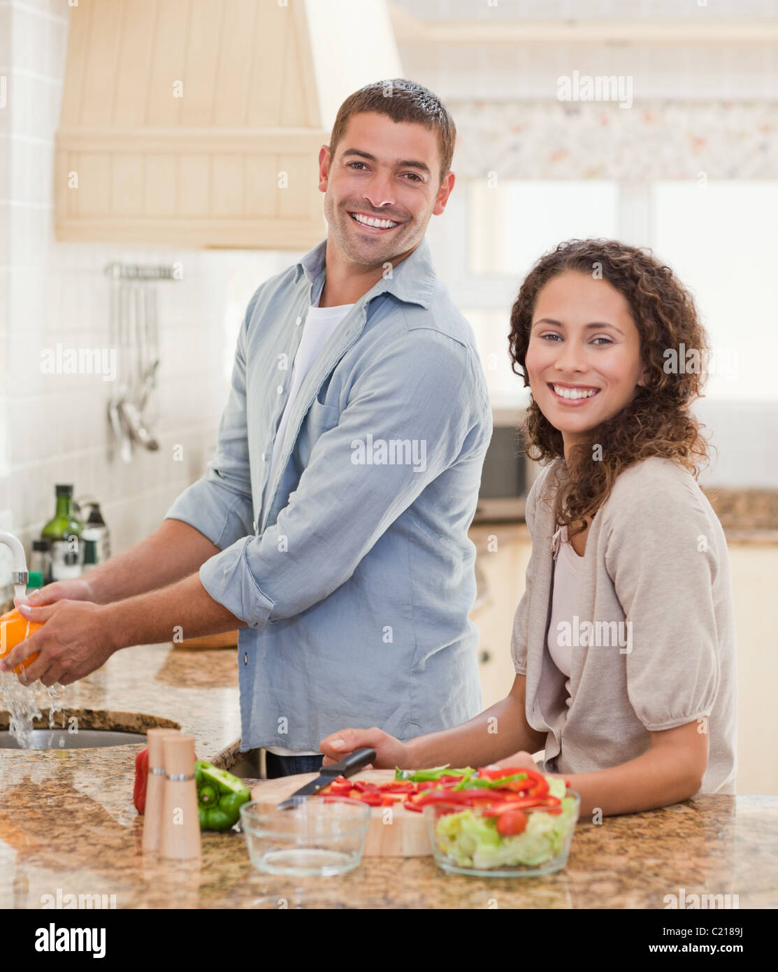 Handsome man cooking with his girlfriend Stock Photo - Alamy