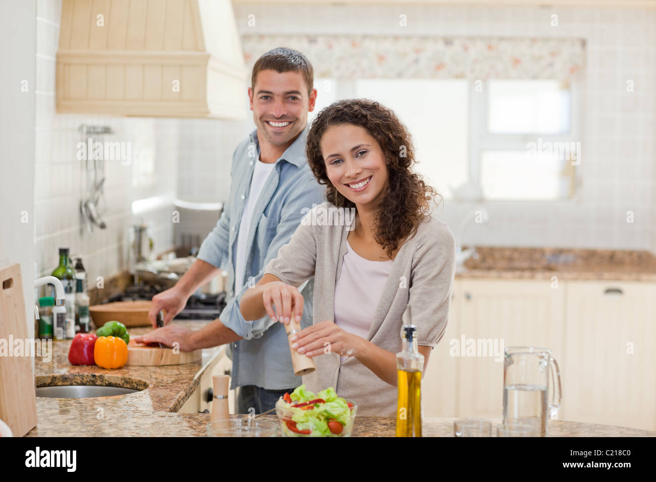 Handsome man cooking with his girlfriend Stock Photo - Alamy