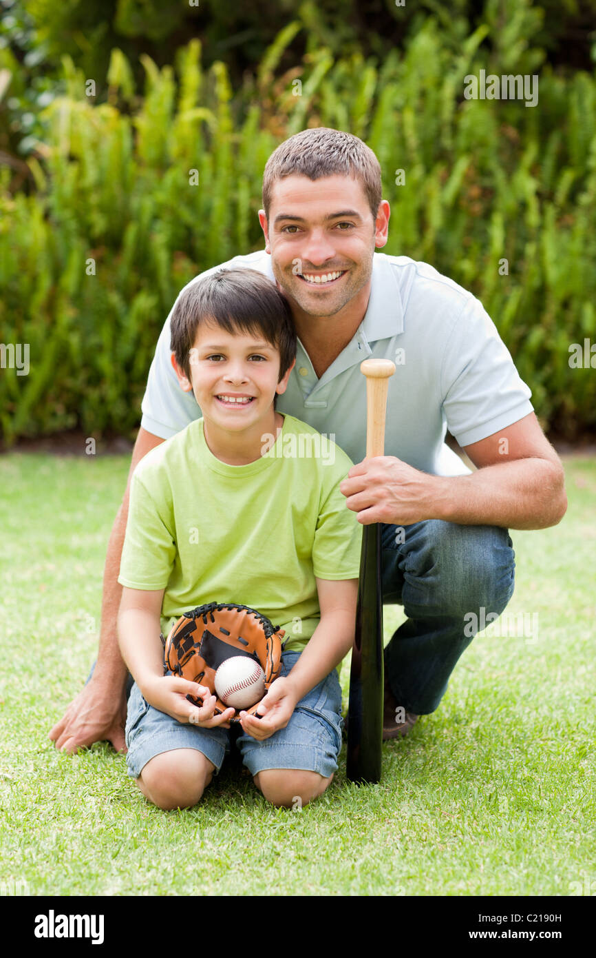 Happy father and his son playing baseball Stock Photo - Alamy