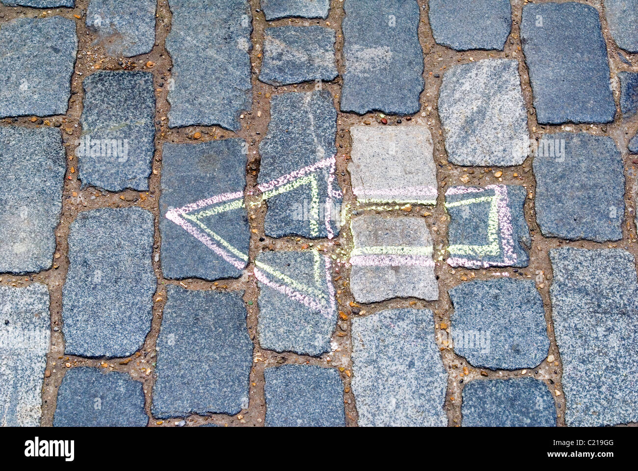 Arrow in Pavement Stock Photo - Alamy