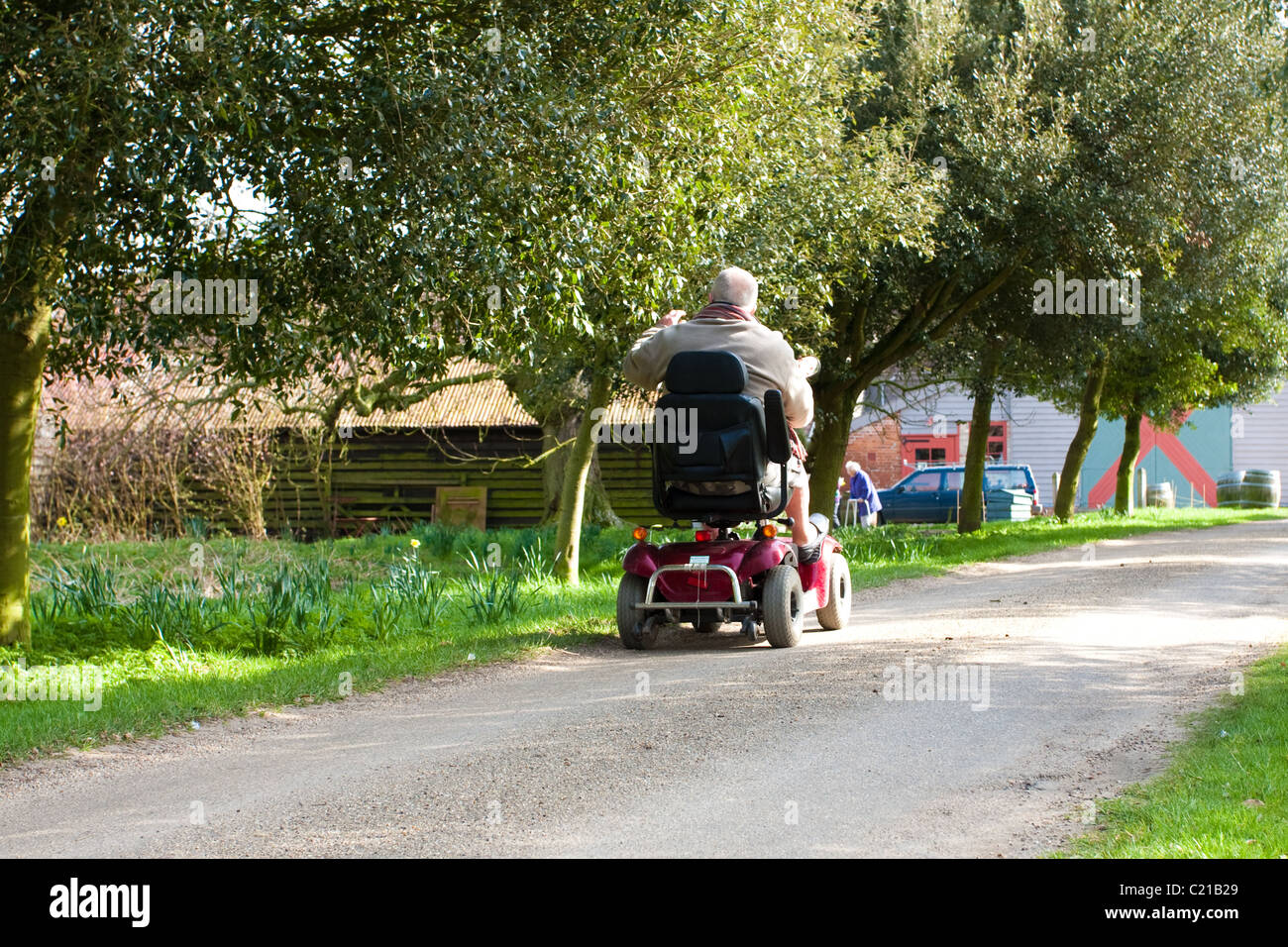 Old man on mobility scooter hi-res stock photography and images - Alamy