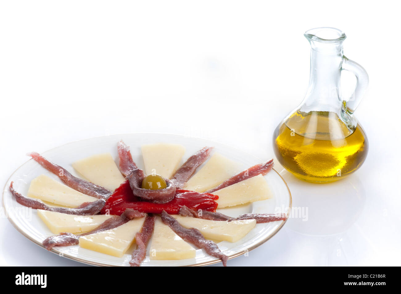 Spanish tapas with manchego cheese, roasted piquillo peppes, olive and ...