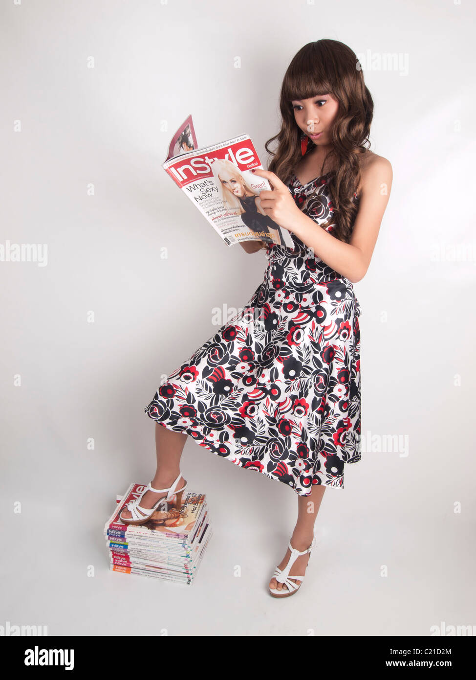 Woman Reading Fashion Magazine