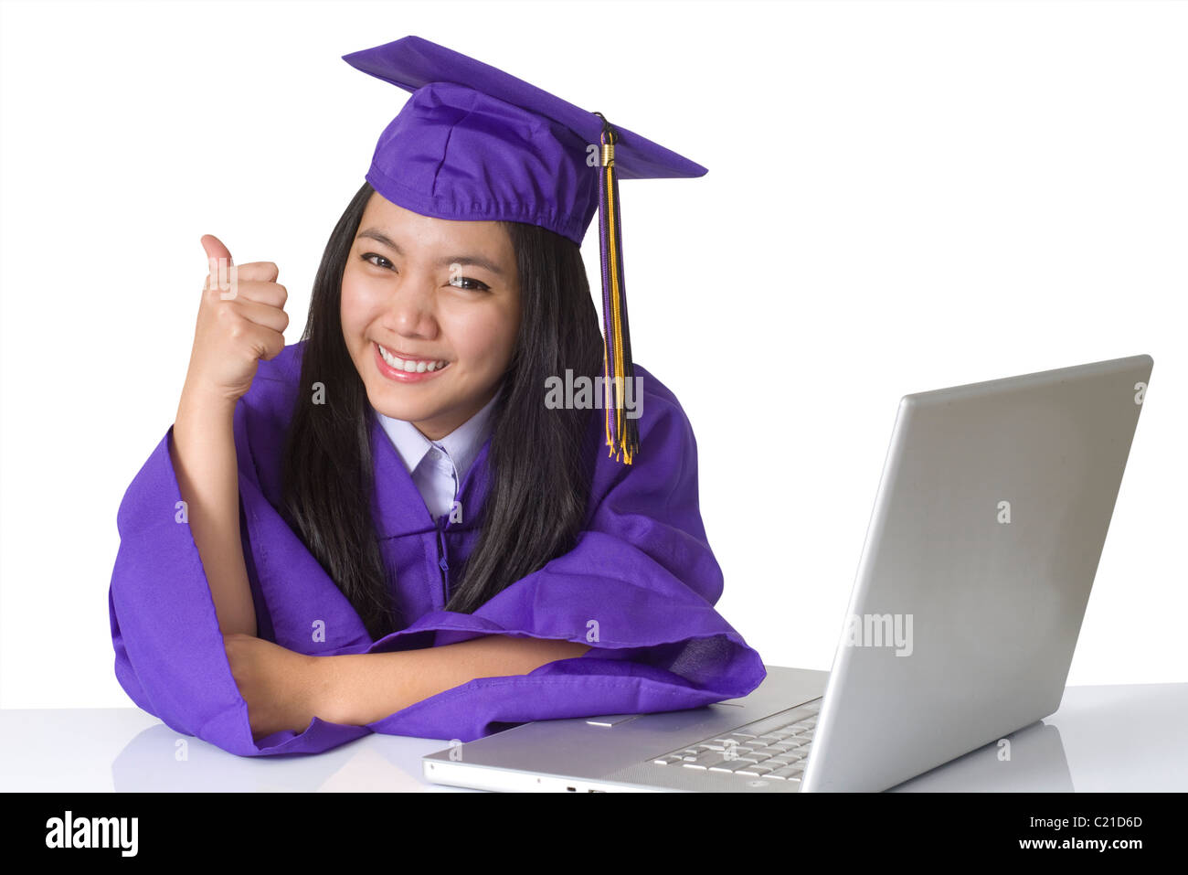 Young woman with graduation cap and gown with thumbs up gesture Stock ...