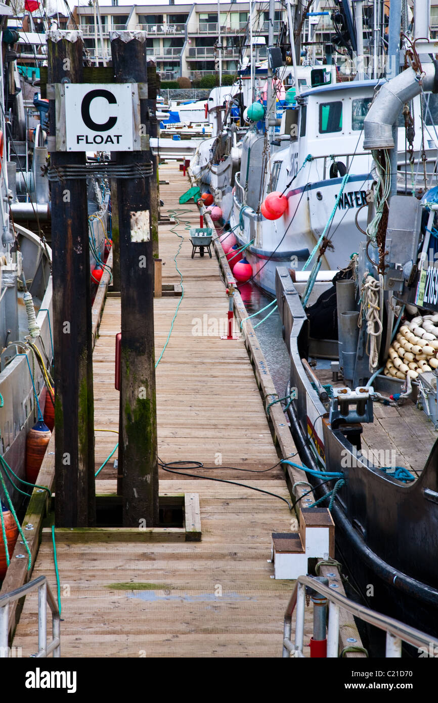 Fishing boat tied up at wharf hi-res stock photography and images - Alamy