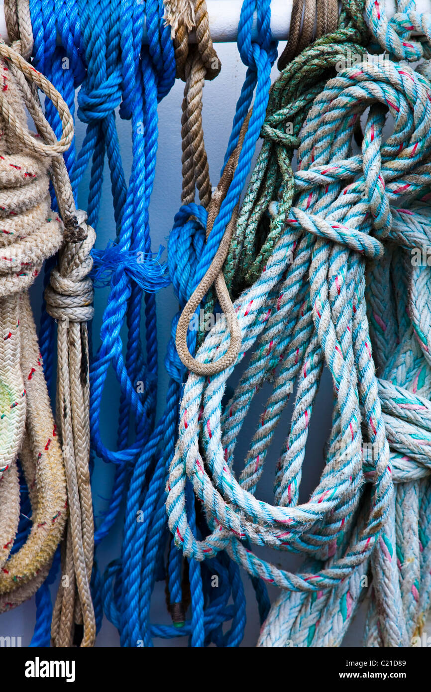 Colored ropes coiled and hung from a fishing boat railing, Vancouver ...