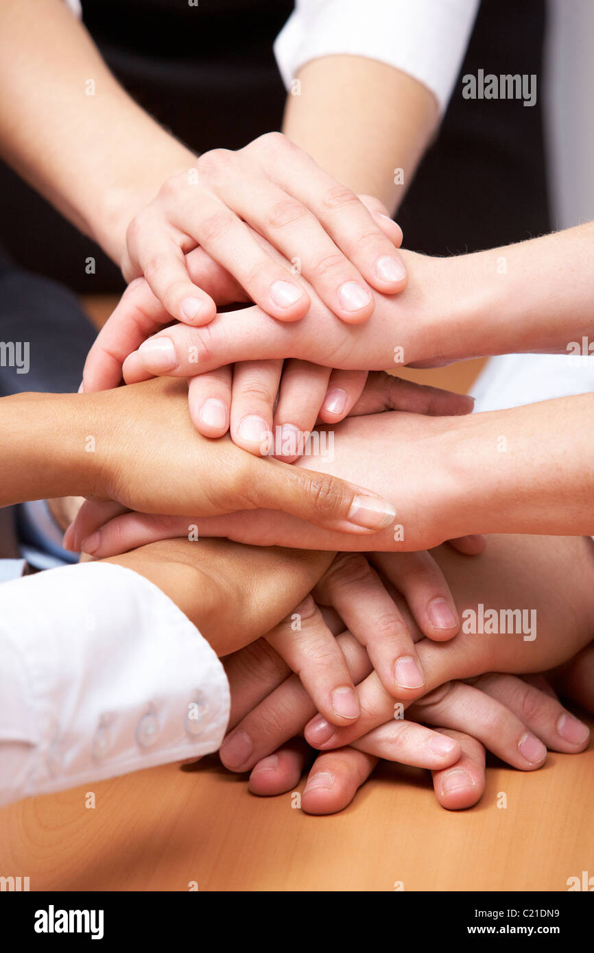 Image of business partners hands on top of each other symbolizing ...
