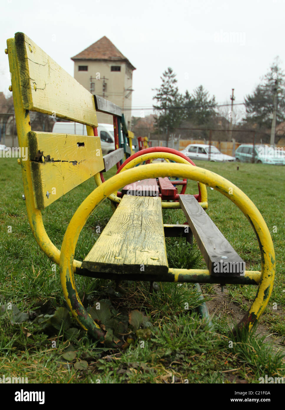 Yellow bench in a garden Stock Photo - Alamy