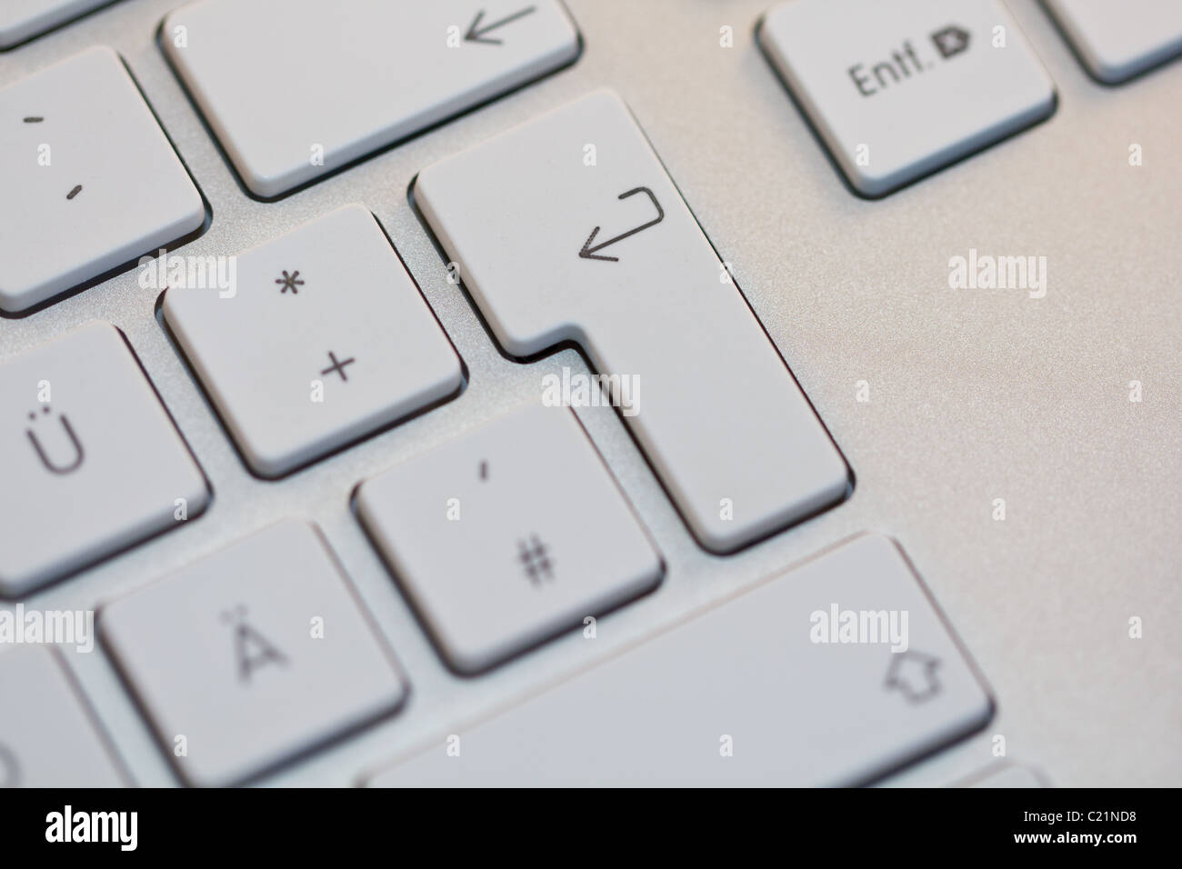 Silver keyboard with white keys Stock Photo - Alamy