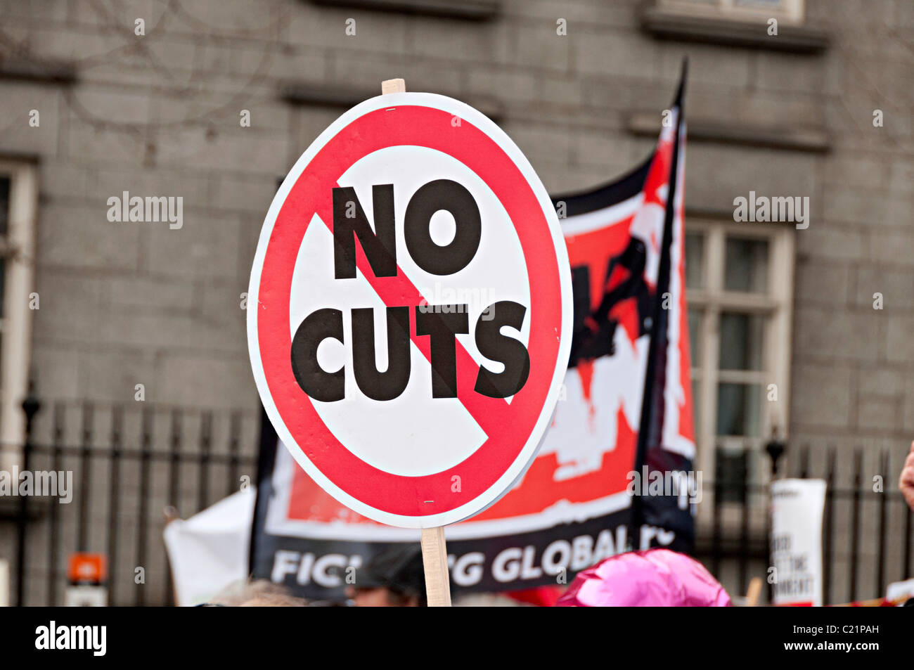 no cuts banners outside parliament as part of the march for the ...