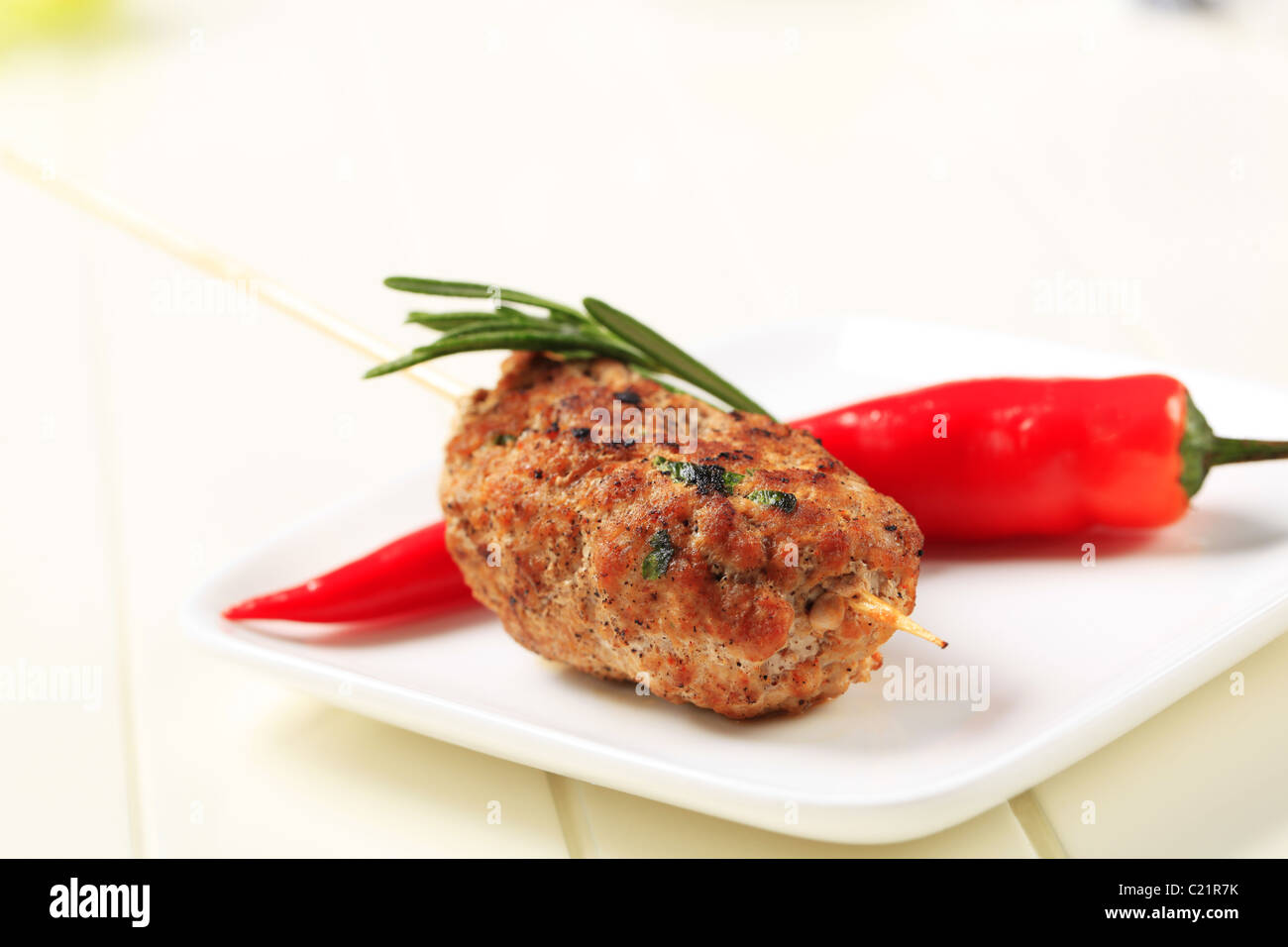 Minced meat kebab on a wooden stick Stock Photo - Alamy