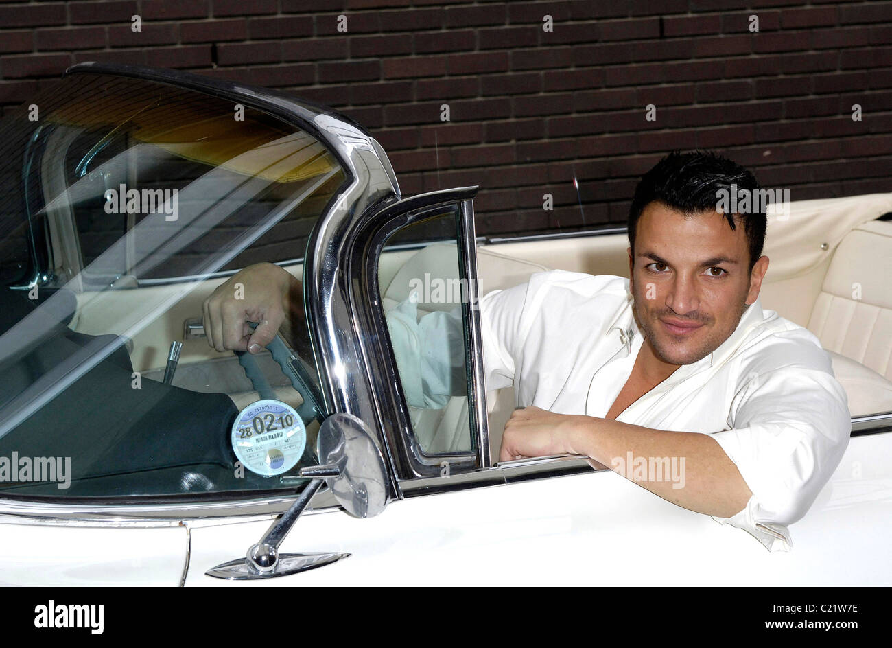 Peter Andre attends a photocall with a white Cadillac to launch 'Peter ...