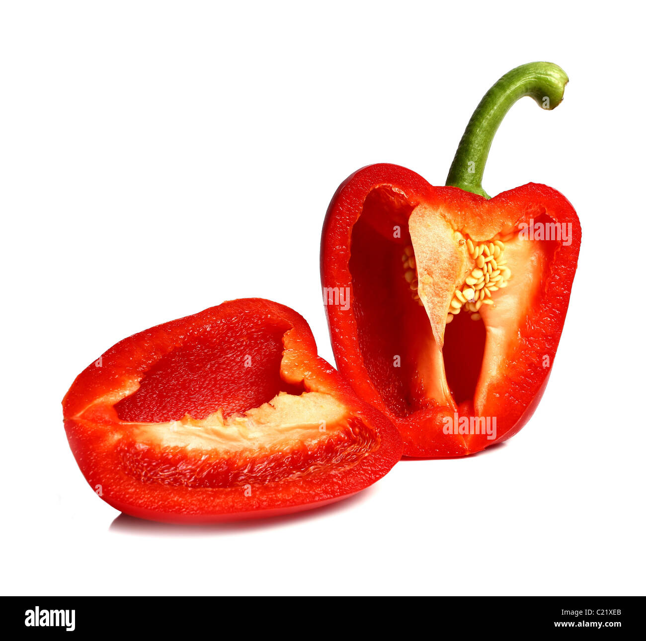 pepper cut on two halves isolated on white background Stock Photo - Alamy