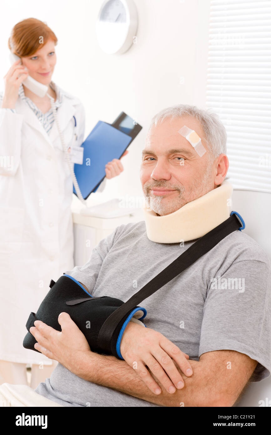 Portrait of senior patient with broken arm in doctor office Stock Photo ...
