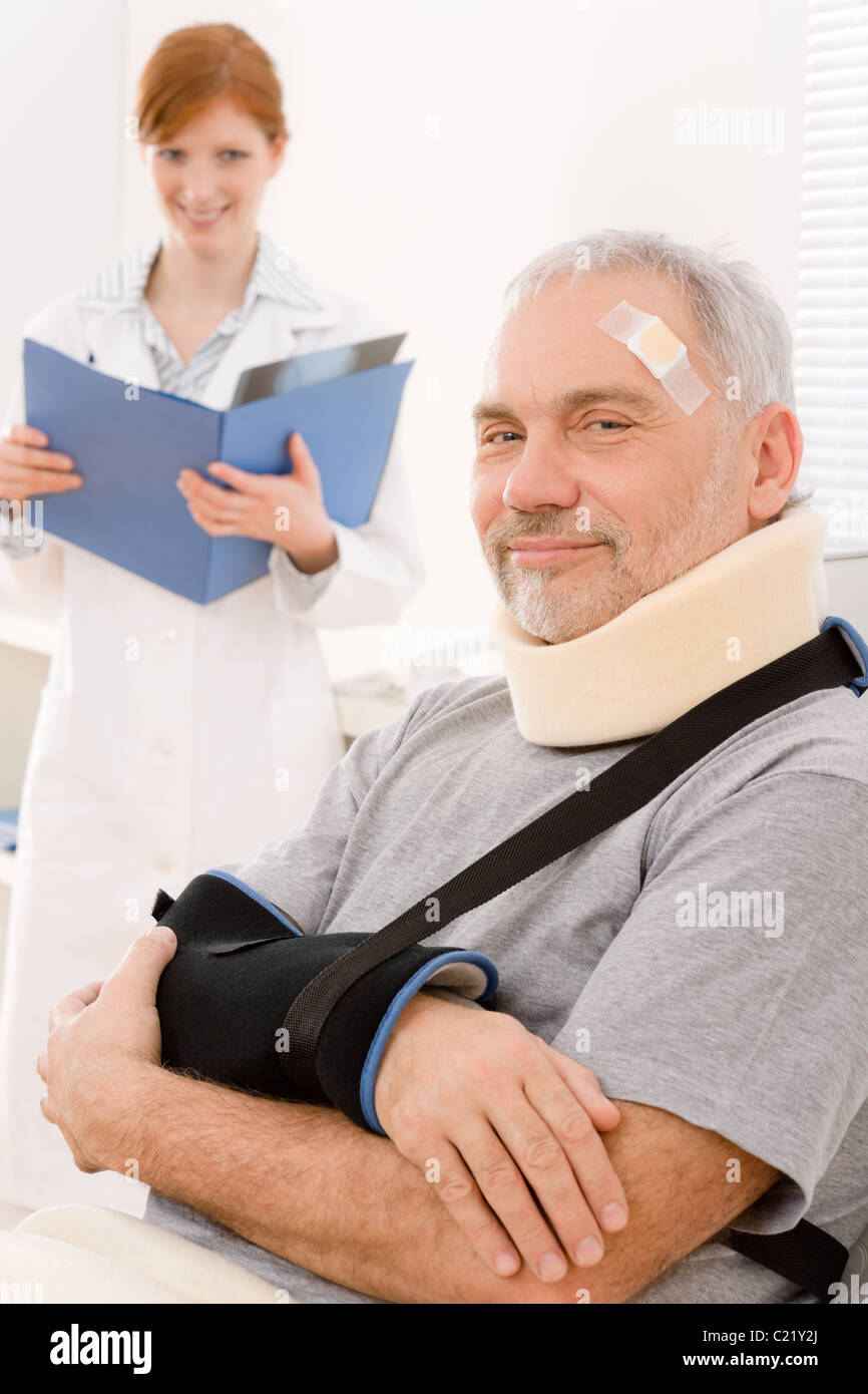 Portrait of senior patient with broken arm in doctor office Stock Photo ...