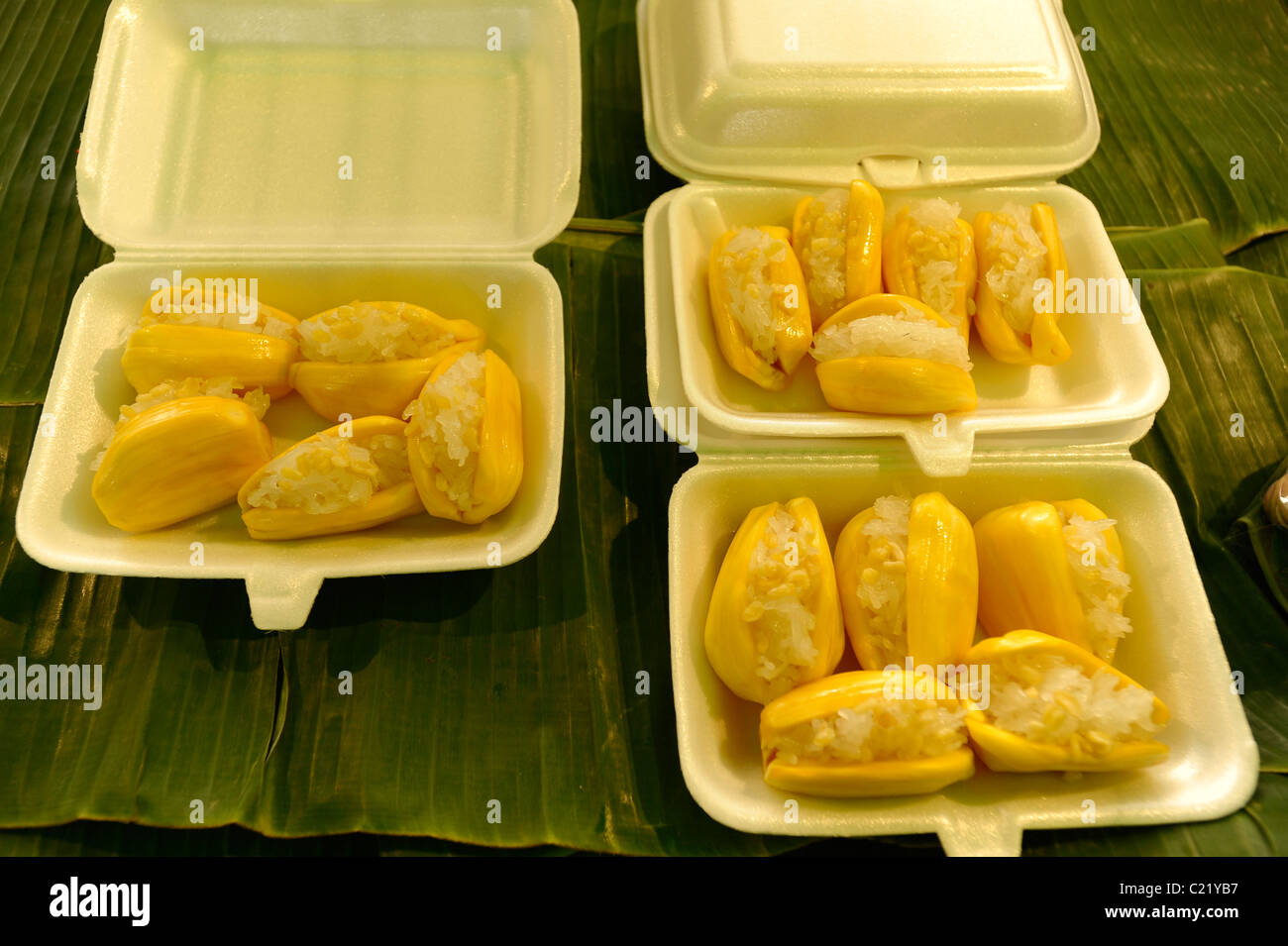 Sweet sticky rice stuffed in jackfruit , thai dessert , street market ...