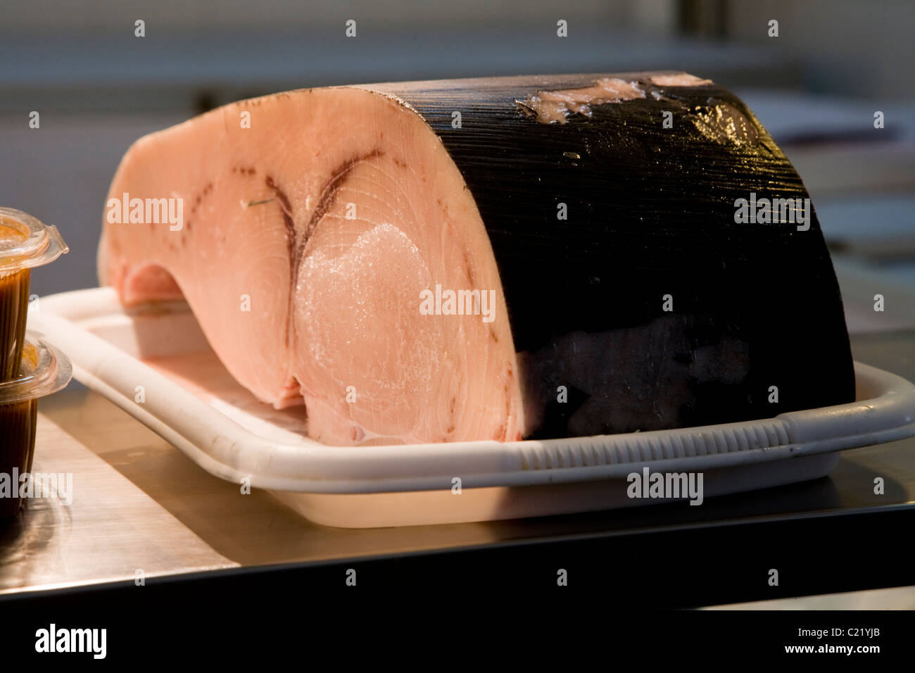 Fresh sword fish / swordfish steak prepared by fishmonger / monger on ...