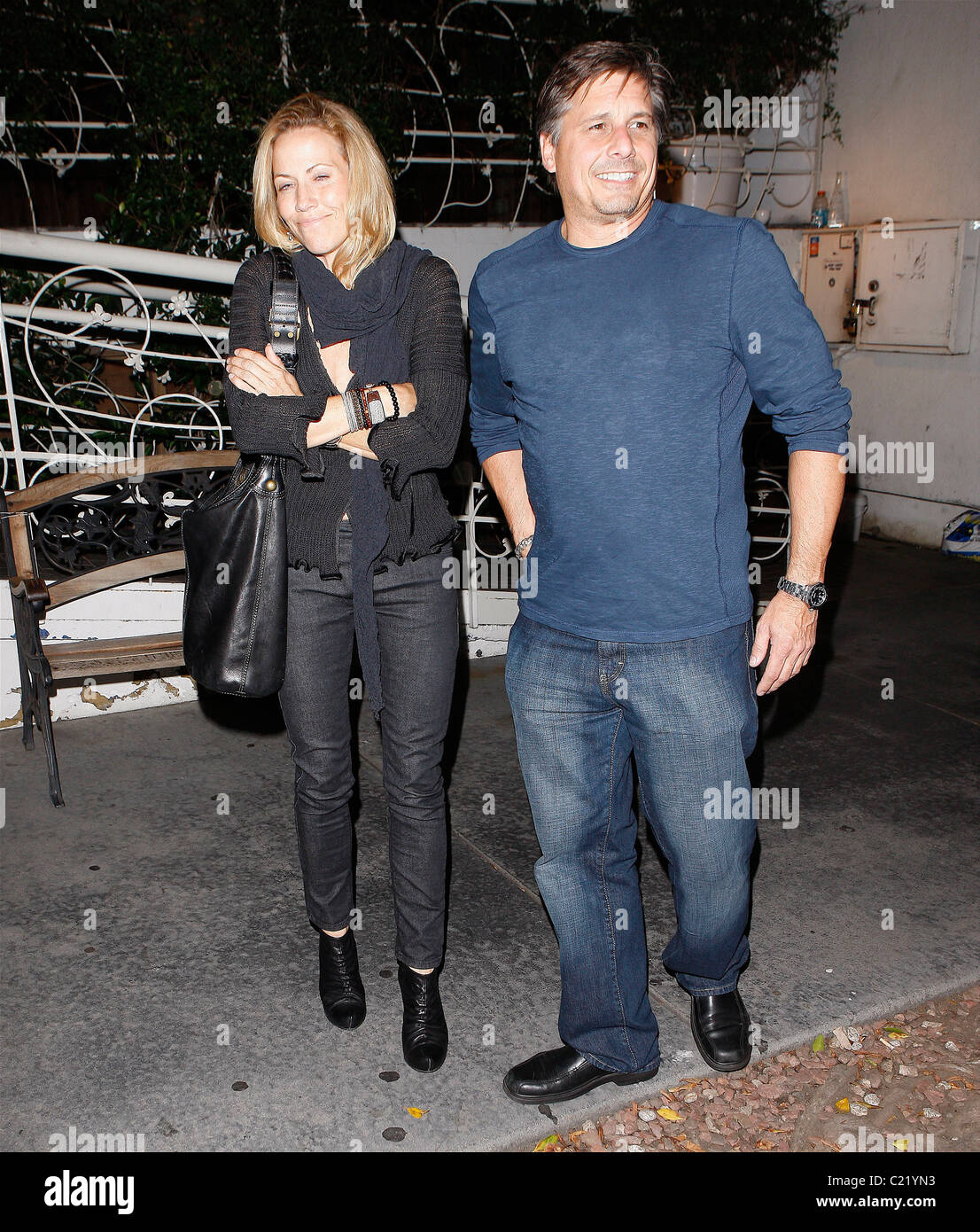 Sheryl Crowe with photographer Kevin Mazur leaving Madeo restaurant Los ...
