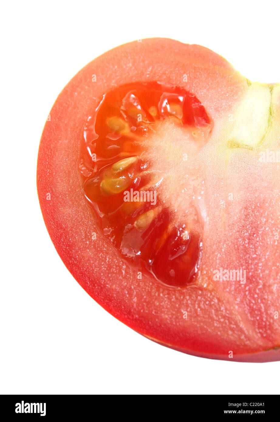 tomato cut close-up isolated on white background Stock Photo - Alamy