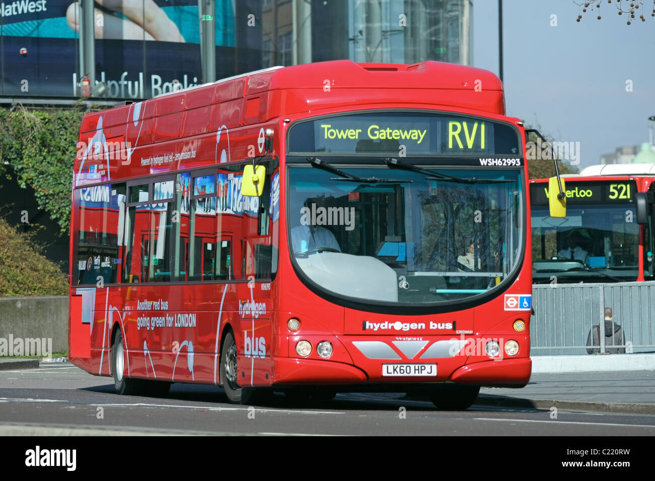 A red London single decker Hydrogen powered bus traveling on its route ...