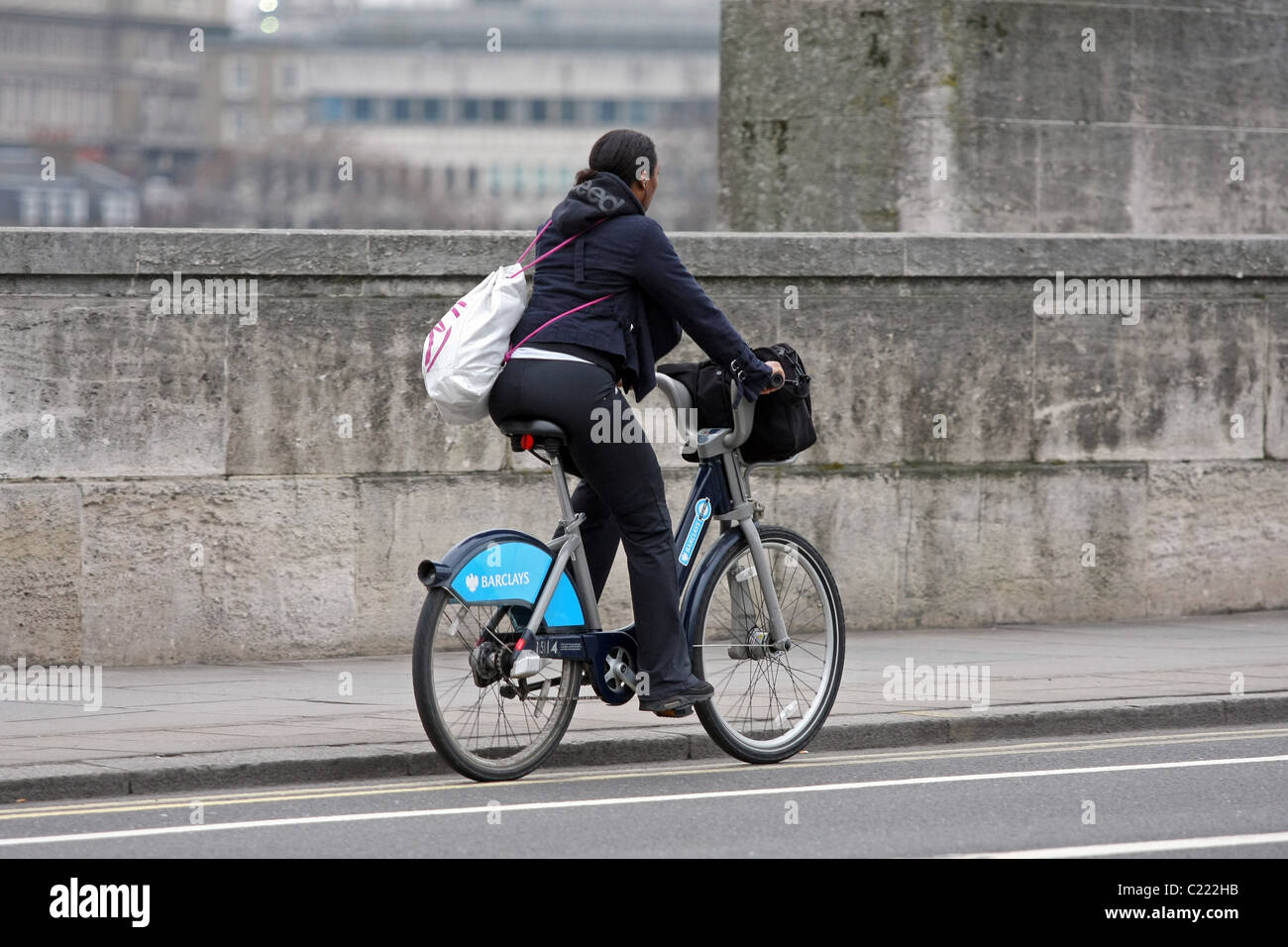 A male cyclist cycling on a Boris Bike in London, England Stock Photo ...