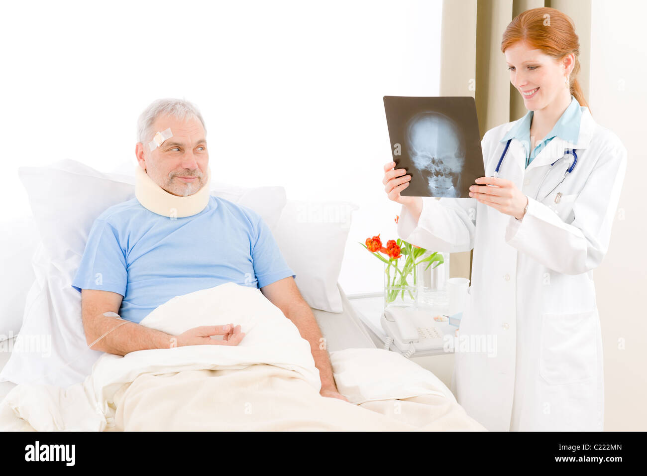 Woman doctor male patient head injury hi-res stock photography and ...