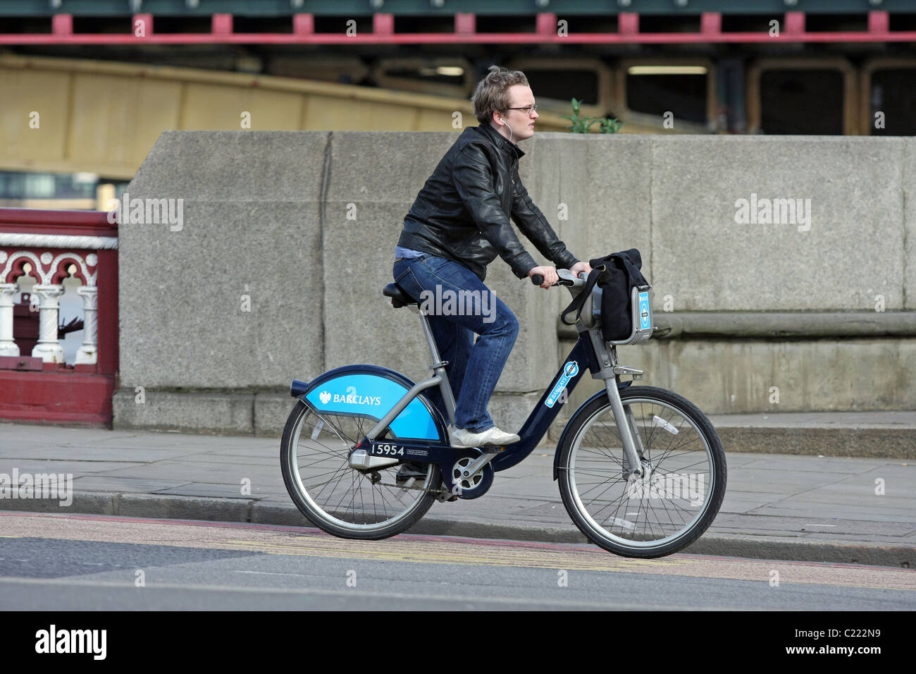 A male cyclist cycling on a Boris Bike in London, England Stock Photo ...