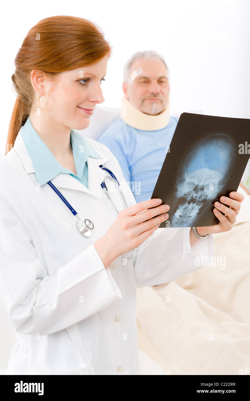 Hospital - female doctor examine x-ray senior patient Stock Photo - Alamy