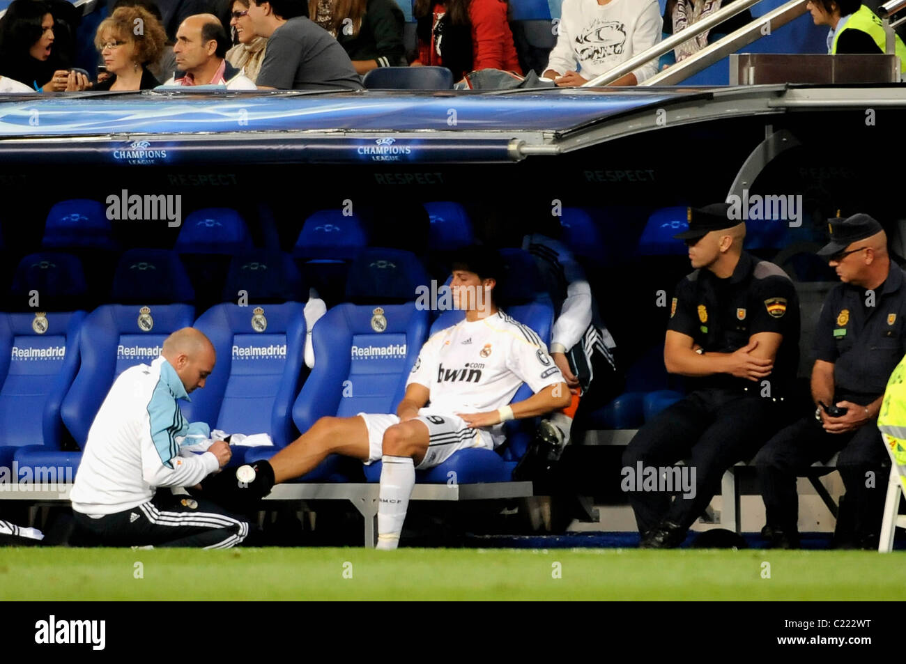 Cristiano Ronaldo receives treatment on the bench during the match ...