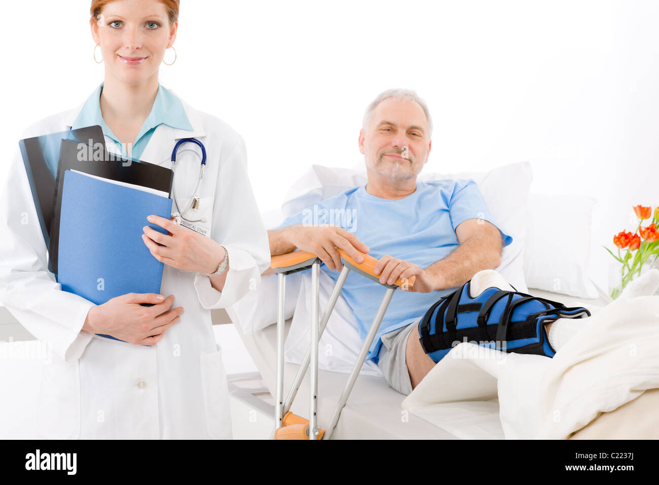 Hospital - female doctor examine senior patient with broken leg Stock ...