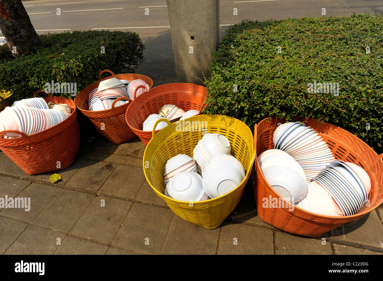 washed plates left out to dry, street restaurant, street life ...