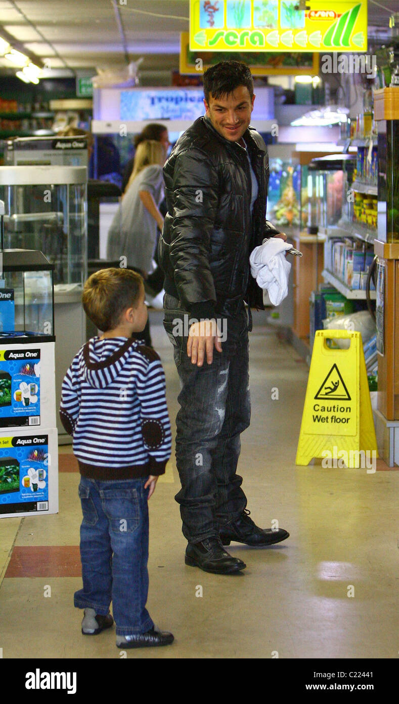 Peter Andre with his child Junior Savva Andrea looking at fish tanks at ...