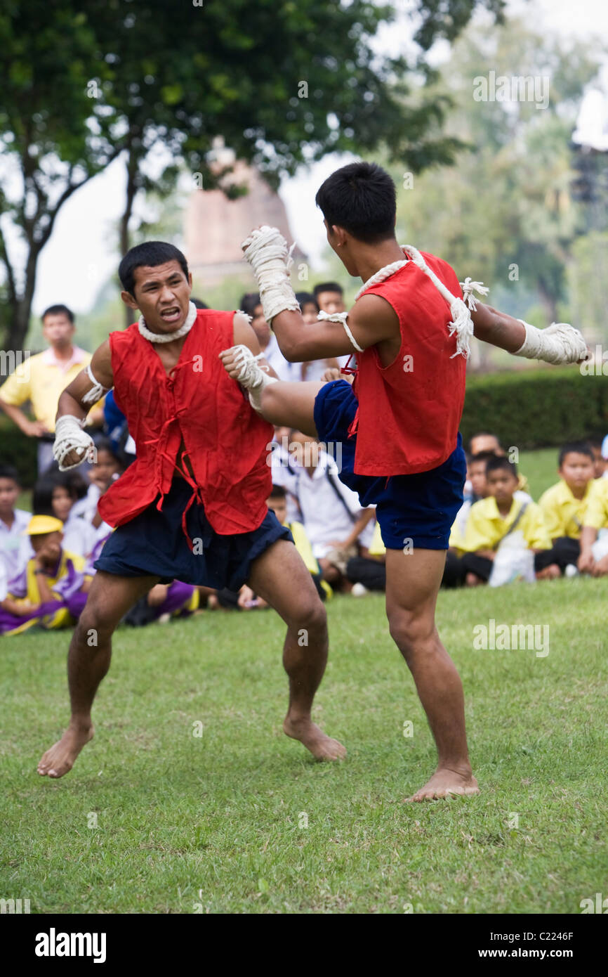 Boxers demonstrating the ancient sport of 'muay kaad chuek' where hands ...