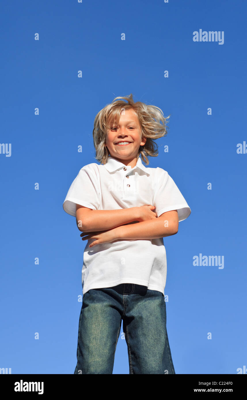 Confident Kid with arms folded having fun outdoor Stock Photo - Alamy