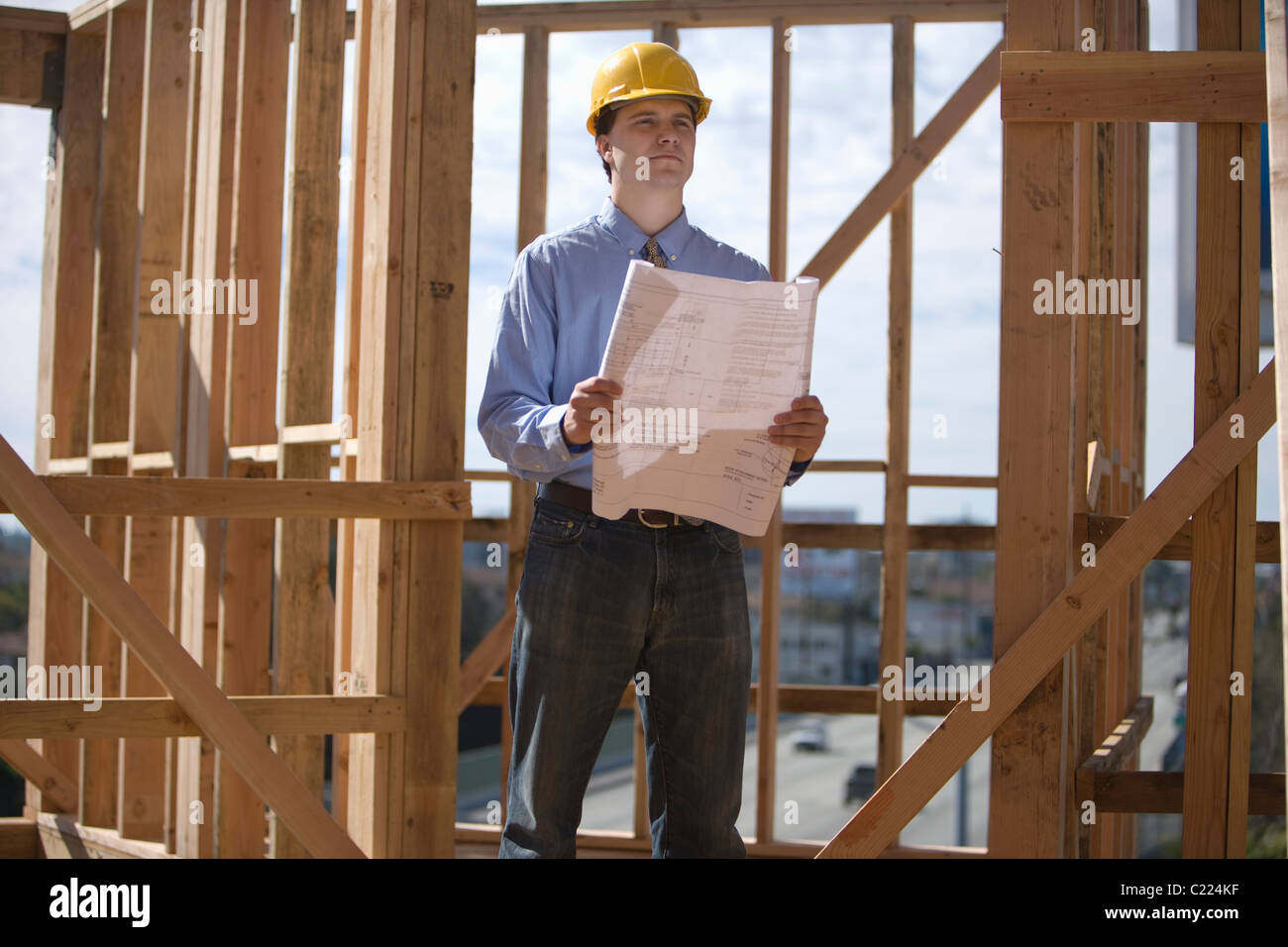 Site manager with building plans Stock Photo - Alamy