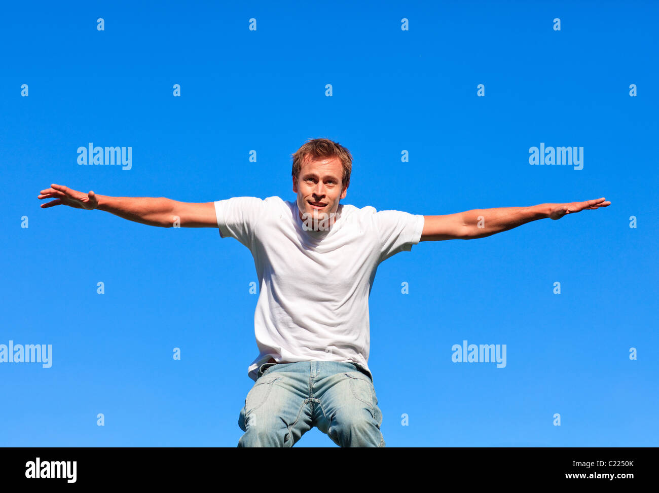 Portrait of a positive Man jumping in the air outdoor Stock Photo - Alamy